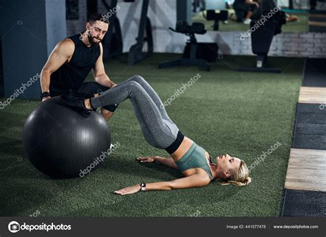 Sportsperson Doing A Hamstring Curl On A Fitness Ball Stock Photo Svitlanahulko Gmail Com