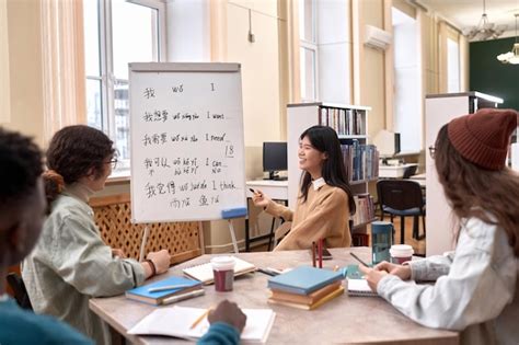 Premium Photo Smiling Asian Woman Teaching Chinese Class