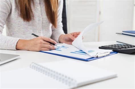 Premium Photo Girl In Gray Cardigan Is Reading A Graph