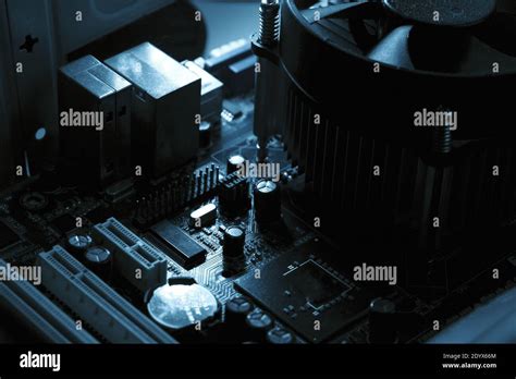 Components On PC Circuit Board Chip Fan Capacitor And Connectors On The Motherboard Of A