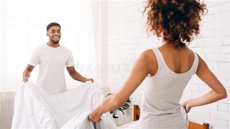 Charming Beautiful Couple In Love Making Bed Together Stock Image