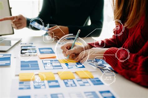 Ux Developer And Ui Designer Brainstorming About Mobile App Interface