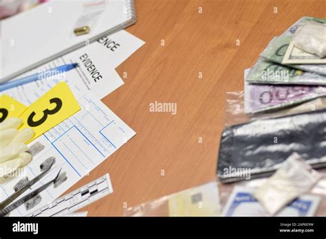 Paperwork During Crime Scene Investigation Process In Csi Laboratory Evidence Labels With