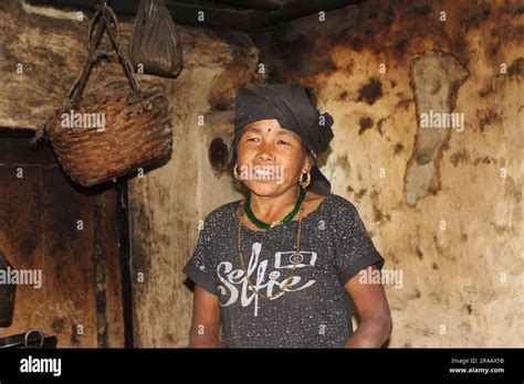 A Nepali Limbuni Mother In Her Traditional Nepalese Home In Taplejung Nepal Stock Photo Alamy