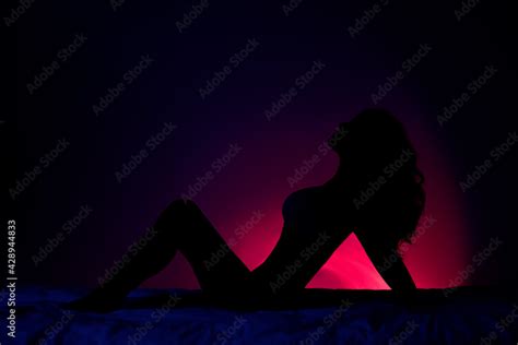 Sexy Woman Shape Posing Over Red Dark Background Stock Photo Adobe Stock