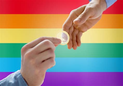 Premium Photo Hand With Gay Pride Rainbow Flag And Wristband