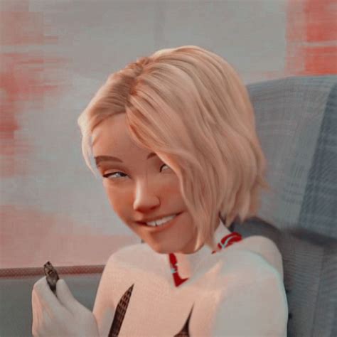 A Woman With Blonde Hair Sitting In A Chair