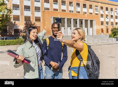 University Student Recording Vlog With Friends Using A Digital Portable