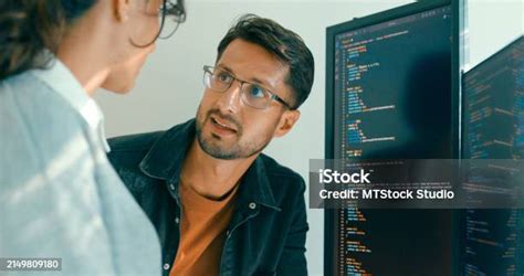 Closeup Of Software Engineering Team Engaged In Problemsolving And Code Analysis For Web
