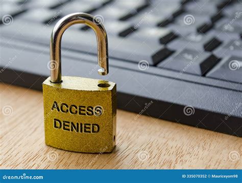 Access Denied Text Engraved On Padlock With Keyboard Background