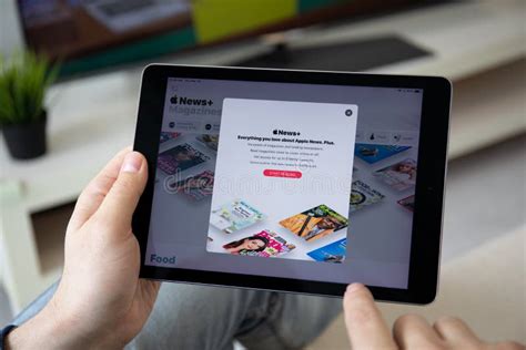 Man Holding IPad Pro With Service Apple News Editorial Photography Image Of Hand Internet