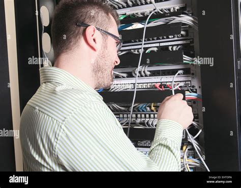 Network Engineer Working In Server Room Stock Photo Alamy