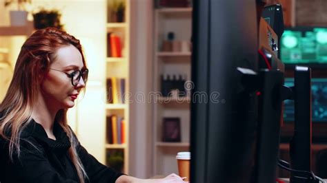 Girl Hacker Looking At Super Computer With Multiple Monitors Stock