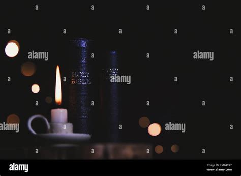 Candlestick And Candle And Holy Cross And Bible And Light Background Stock Photo Alamy