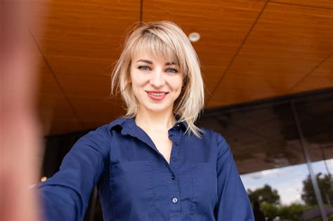 Premium Photo The Happy Beautiful Blonde Takes A Selfie