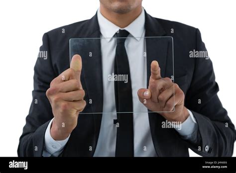 Businessman Using Transparent Interface Against White Background Stock Photo Alamy