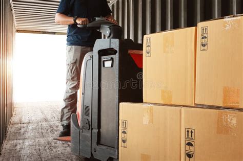Workers Loading A Package Boxes Inside Shipping Cargo Container Supply