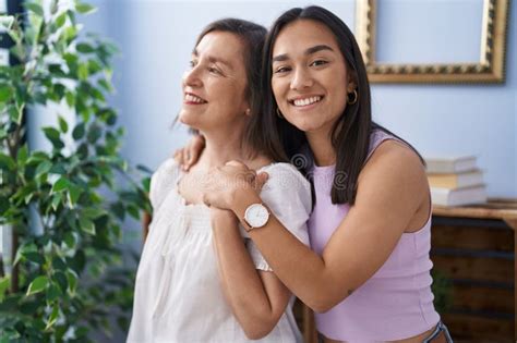Two Women Mother And Daughter Smiling Confident Hugging Each Other At