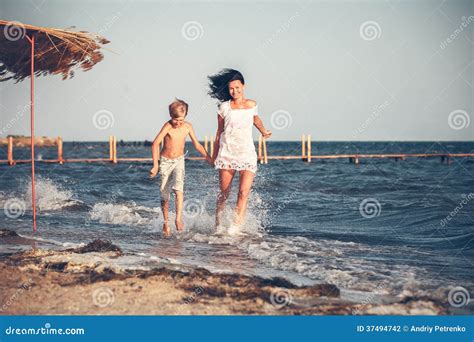 Mother And Son Having Fun On The Beach Stock Photo Image Of Beautiful Nature