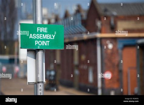 Fire Assembly Point Sign Outside Business Premises In England Stock