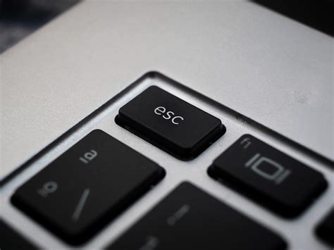 Premium Photo Black Esc Button Escape Close Up On A Laptop Keyboard