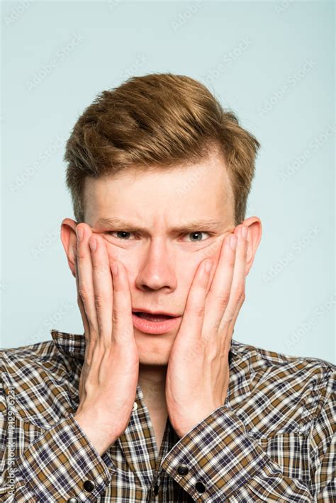 Uncomprehending Puzzled Perplexed Confused Man Grasping His Face In Disbelief Portrait Of A