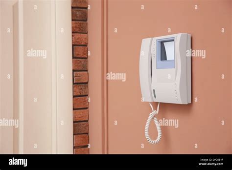 Modern Intercom System With Handset On Beige Wall Space For Text Stock Photo Alamy