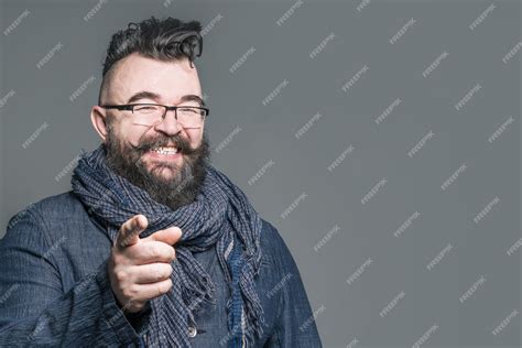 Premium Photo Laughing Bearded Man With A Mohawk Hairstyle Showing