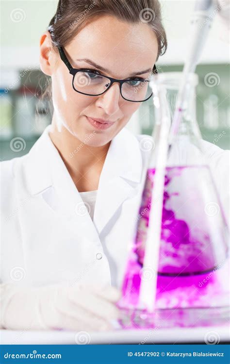 Scientist Putting Violet Liquid Into The Flask Stock Photo Image Of Glass Science 45472902