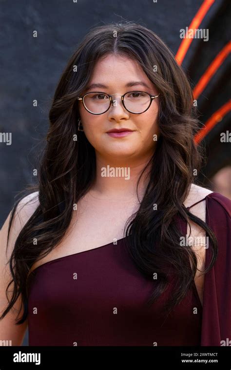 Megan Richards Poses For Photographers Upon Arrival At The World