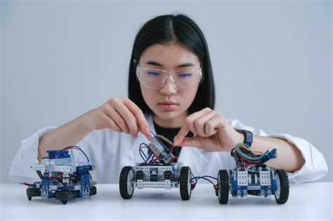 Female Engineer Assembling Robotics Kits Modern Lab Stem Education Robotics Development