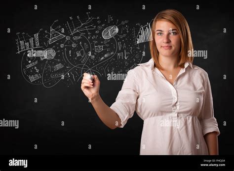 Pretty Girl Sketching Graphs And Diagrams On Wall Stock Photo Alamy