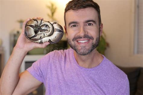 Cute Man Holding Exotic Ball Python Stock Image Image Of Body Curve