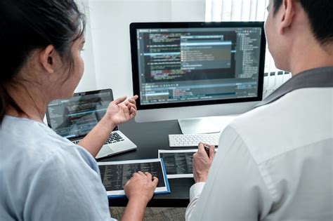 Premium Photo Team Of Developer Programmer Working On Coding Program