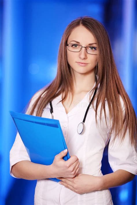 Medicine A Beautiful Smile From A Doctor In A Woman`s Medical Clothes A Young Doctor Graduate