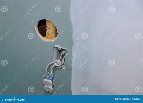 Installation Of A New Current Socket By An Electrician Working In A Construction Site For A New Installation Of A New Current Socket By An Electrician Working In A Construction Site For A New