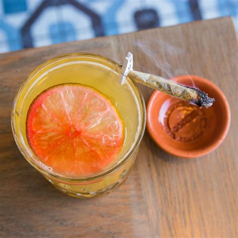 This Tropical Cocktail Is Served With A Faux Joint To Keep Lit While