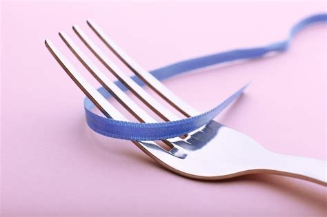 Premium Photo Stages Of Tying Bow On Fork Closeup
