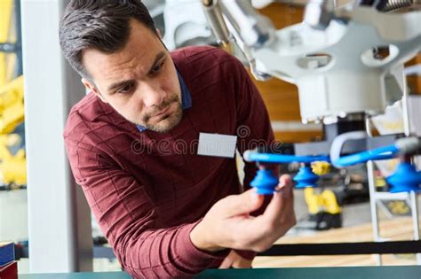 Engineer Programming Robotic Arm For Industry Automation And Inspection Stock Image Image Of