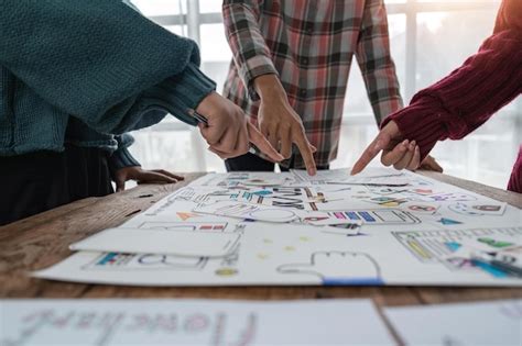 Premium Photo Ux Developer And Ui Designer Brainstorming About Mobile App Interface Wireframe