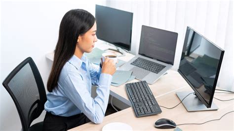 Asian Woman Programmer Typing Source Code With Computer Pc For