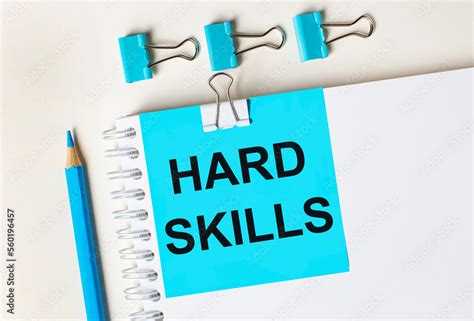 Stationery Light Blue Paper Clips Pencil And Blue Paper With The Text HARD SKILLS On A Light