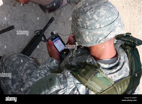 An Army Medic Accesses Medical Records Using The Mc4 Handheld Device