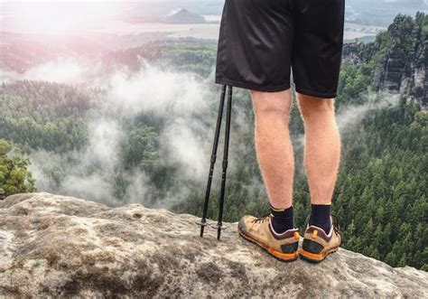 Premium Photo Nordic Walking Sticks And Naked Legs In Sport Shorts Body Of Mountain Hiker With