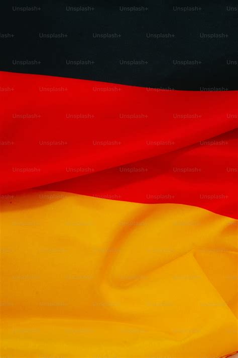 빨간색 노란색 및 검은 색 깃발의 클로즈업 사진 Unsplash의 독일 이미지