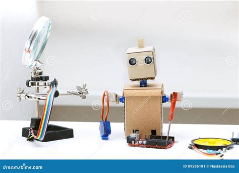 Robot With Hands And Other Parts For Assembling The Robot Are On Stock