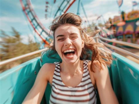 Premium Photo A Woman Is Riding A Roller Coaster And Is Smiling