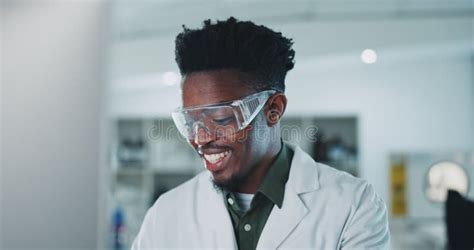 Black Man Scientist And Typing With Data And Science In Laboratory