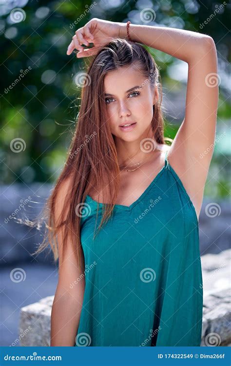 Close Up Portrait Of Beautiful Girl In A Green Dress Stock Image