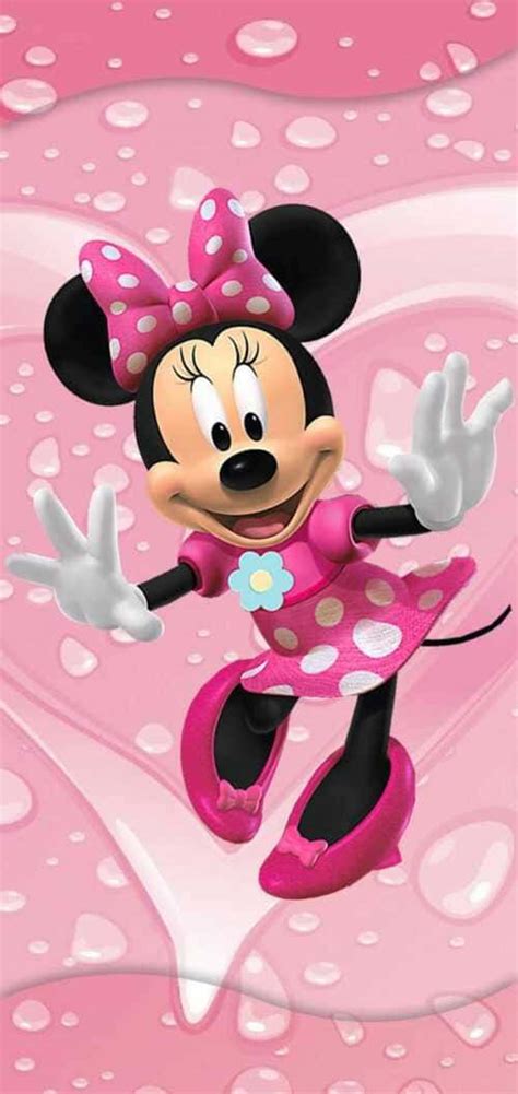 Download Minnie Mouse Looking Adorable In Her Signature Pink Bow